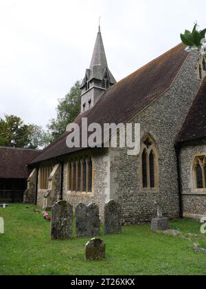 Old gravestone standing in front of a church in Wherwell England Stock ...