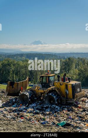 Heavy machinery is spreading the garbage at the King County Cedar Hills Regional Landfill ...