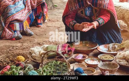 Traditional pigment material used by the incas, Andean woman working in ...