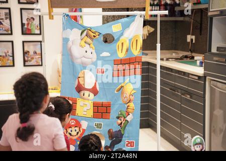 Kids playing Super Mario Bros Movie Bean Bag Toss Game-Throwing ...