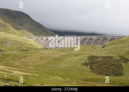 Cruachan Dam at Cruachan reservoir below Munro mountain Ben Cruachan ...