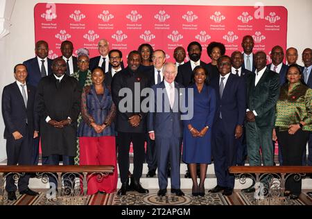 King Charles III (centre) poses for a photograph with faith leaders at Buckingham Palace, London ...