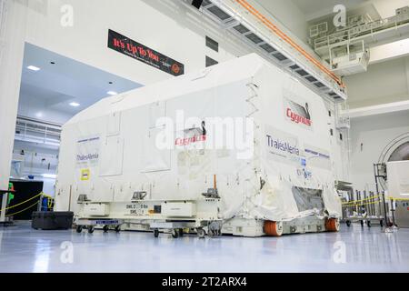 Cygnus Pressurized Cargo Module Arrival. A crane is used to lift the ...