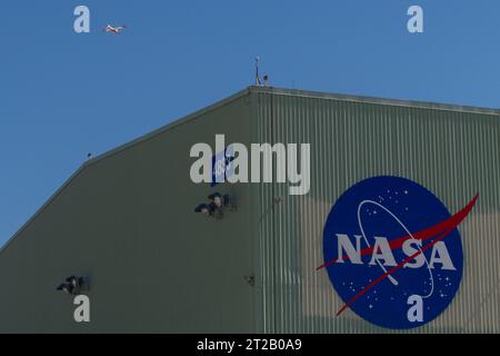 . The Alta-X aircraft flies by the former space shuttle hangar at NASA ...