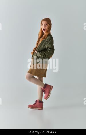 amazed child with long hair on yellow background, portrait Stock Photo ...