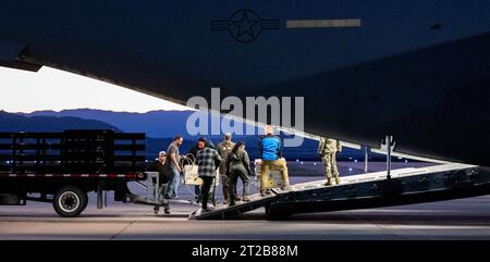 OSIRIS-REx Sample Return. Recovery and curation teams join a container ...