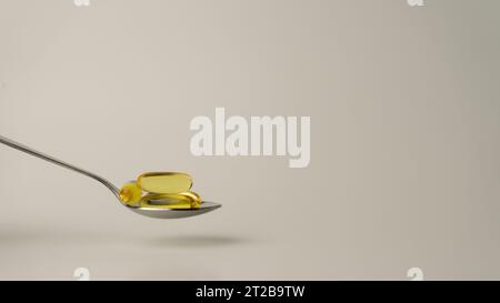 A spoon full of Omega-3-rich wild salmon and fish oil capsules ...
