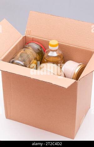 Food Reserves or Donation Box: Carton Box with Canned Food, Cereals and ...