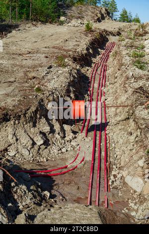 Laying High-Voltage Cables Underground Through the Forest to Connect ...