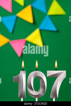 Birthday candle number 107 - Vertical anniversary card with green ...