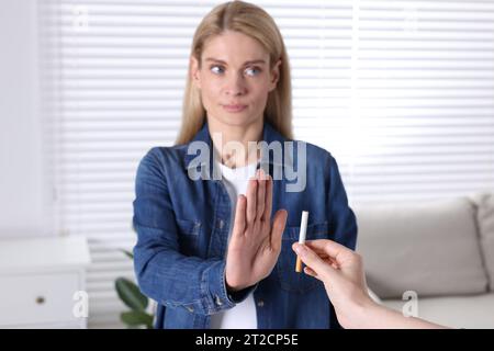 Woman refusing cigarette at home. Quitting smoking concept Stock Photo ...
