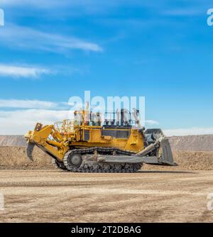 open pit diamond mine, mining grader and dust truck maintaining the ...