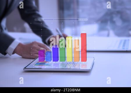 Colorful augmented reality bar graph floating above the desktop surface ...