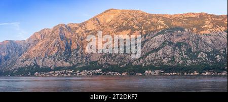 Town of Dobrota in the Bay of Kotor in smoke of a summer wood fire ...