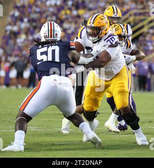 Auburn defensive lineman Marcus Harris stands in the huddle during a ...