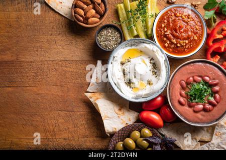 Selection of arabic mezze food - foul, labneh yogurt, muhamara dip on ...