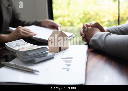 Real estate agent presenting property investment opportunity in office ...