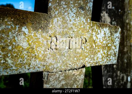 R.I.P Rest In Peace on a cross headstone in English church graveyard ...