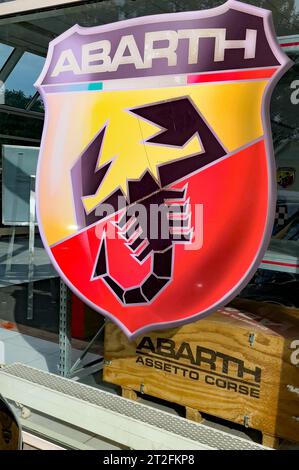 Italian car brand Abarth, company logo with scorpion, logo on a column ...