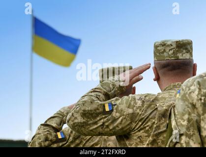 Ukrainian soldiers giving salute. Flag of Ukraine. Armed Forces of ...