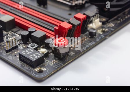 Gaming motherboard without CPU, red details, power switch, POST, on ...