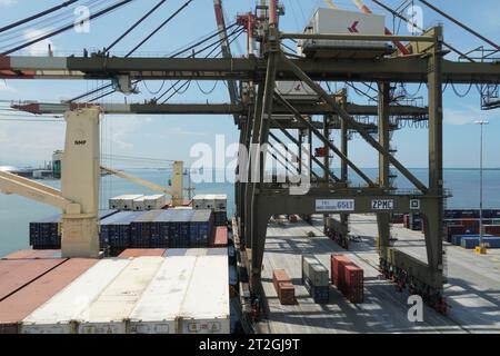 Container vessel equipped with cranes during cargo operation loading ...
