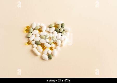 Scattered heart shaped pills on green background, flat lay Stock Photo ...