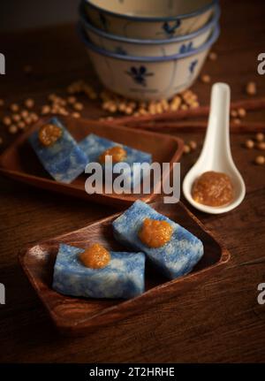 Selective focus image of Nyonya kuih “Kaya Kuih” (Blue Glutinous Rice ...