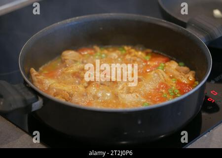 cooking chicken curry in a cooking pan Stock Photo - Alamy