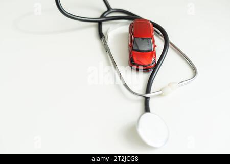 Car diagnostics, stethoscope and car on white background, concept of ...