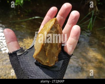 Flint hand axe found in the river, Neolithic era. Ancient stone tool of ...