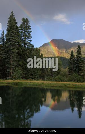 A rainbow seen in mountains in Colorado's San Juan National Forest ...