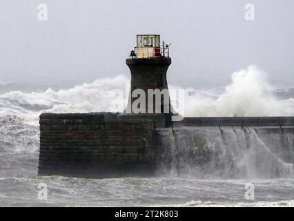 Waves crash against South Shields lighthouse after the top was ripped ...
