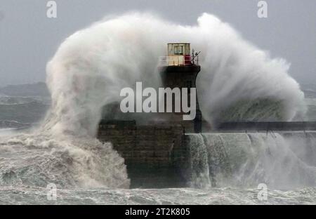 Waves crash against South Shields lighthouse after the top was ripped ...