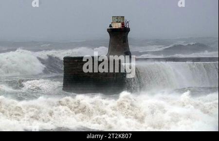 Waves crash against South Shields lighthouse after the top was ripped ...