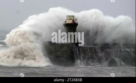 Waves crash against South Shields lighthouse after the top was ripped ...