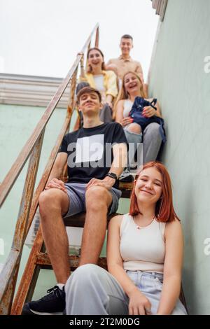 happy funny teen girls in casual checkered shirt carry backpack, school ...