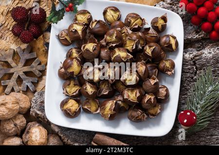 Roasted chestnuts surrounded by wintery decor Stock Photo - Alamy