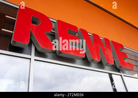 Facade with sign and logo of Rewe Stock Photo - Alamy