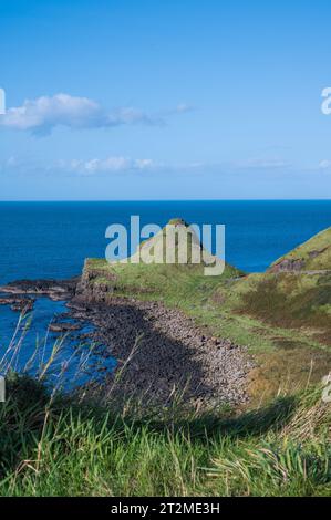 People walking the coastal trail leading to the Giants Causeway. County ...