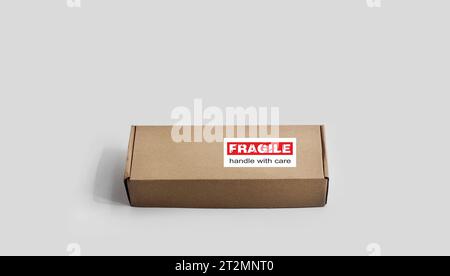 A rectangular cardboard box. Monochrome light background. An adhesive ...