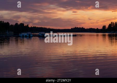 colorful sunset over the sea lake with dark red clouds in summer Stock ...