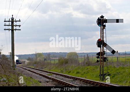 Semaphore distant railway signal with a approaching train at Barnetby ...