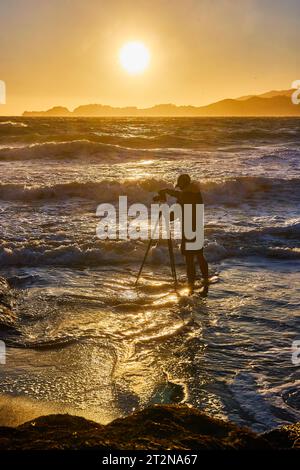 bridge on the beach at sunset Stock Photo - Alamy