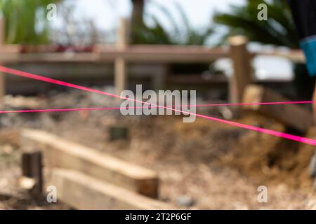 Pink builders string-line closeup on constructions site in selective ...