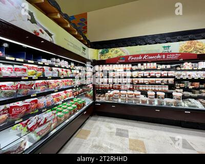 Fresh kimchi refrigerated display inside the Super H Mart Asian grocery ...