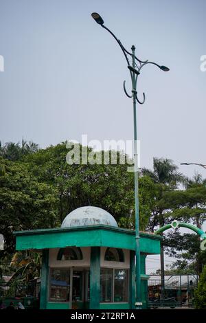 a dome-shaped guard post at the top of the building, and street lights ...