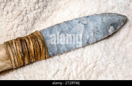 Ancient stone dagger. Historical knife with bone handle Stock Photo - Alamy