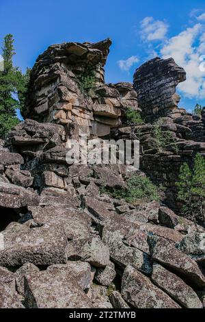 Amazing shaped high Syenite rock with through hole igneous mountain ...