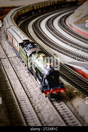 Miniature train railway model set by a station. Handmade railways model ...
